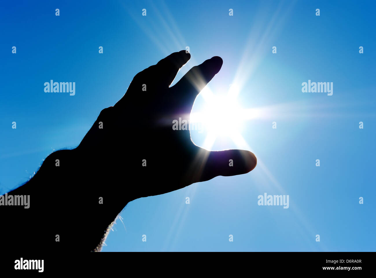 Sun in hand. Conceptual design Stock Photo - Alamy
