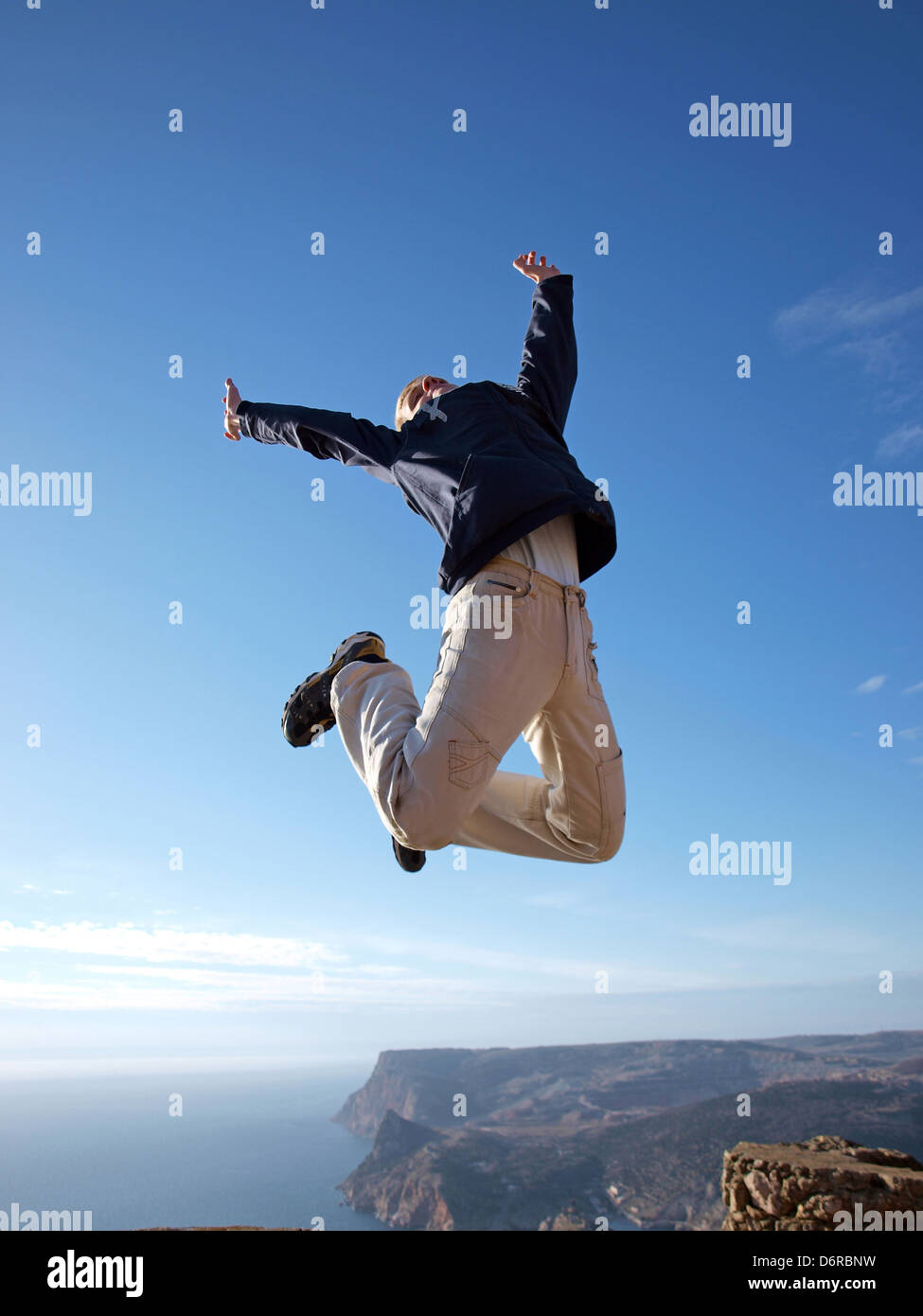 Man jump blue sky hi-res stock photography and images - Alamy