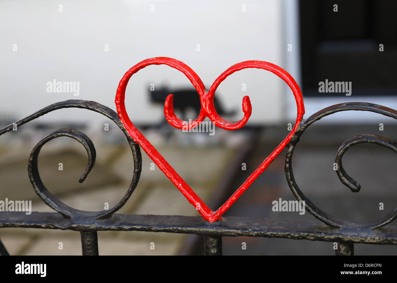 Red heart painted on a front garden iron gate Stock Photo - Alamy