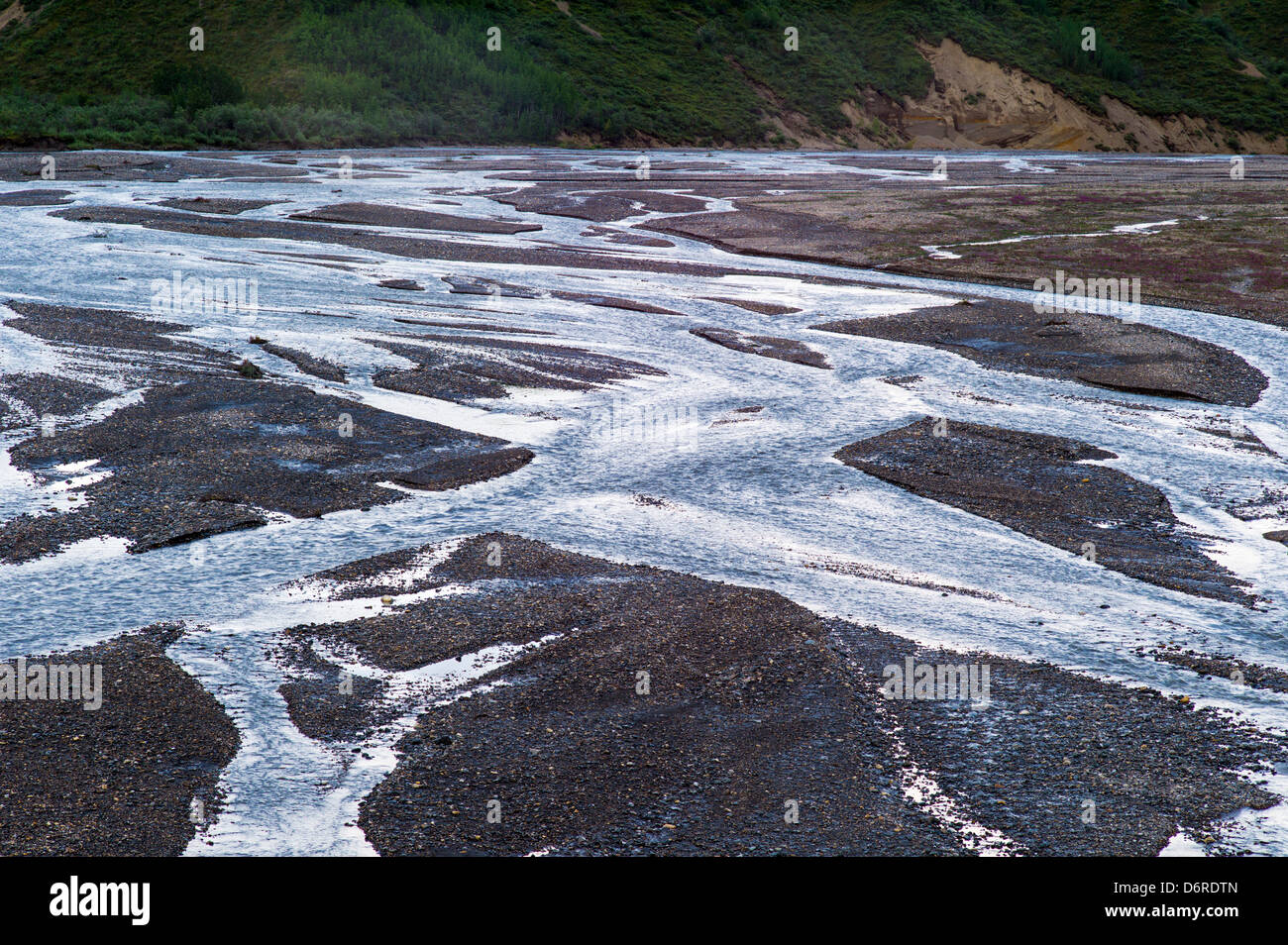 Dusk skies reflect in the braided East Fork of the Toklat River, Denali ...