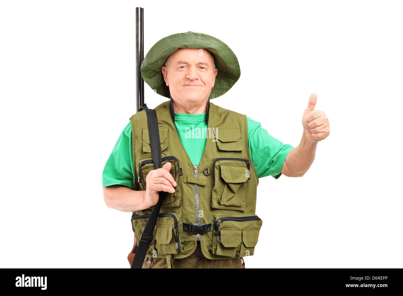 A male hunter with shotgun giving a thumb up isolated on white ...