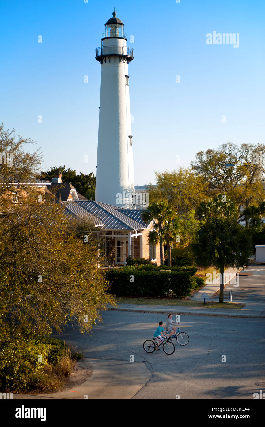The Lighthouse on St. Simon's Island, Georgia with two young people ...