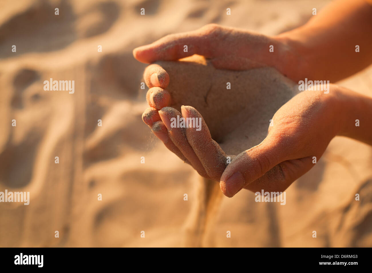 time passing, sand in the hands Stock Photo - Alamy