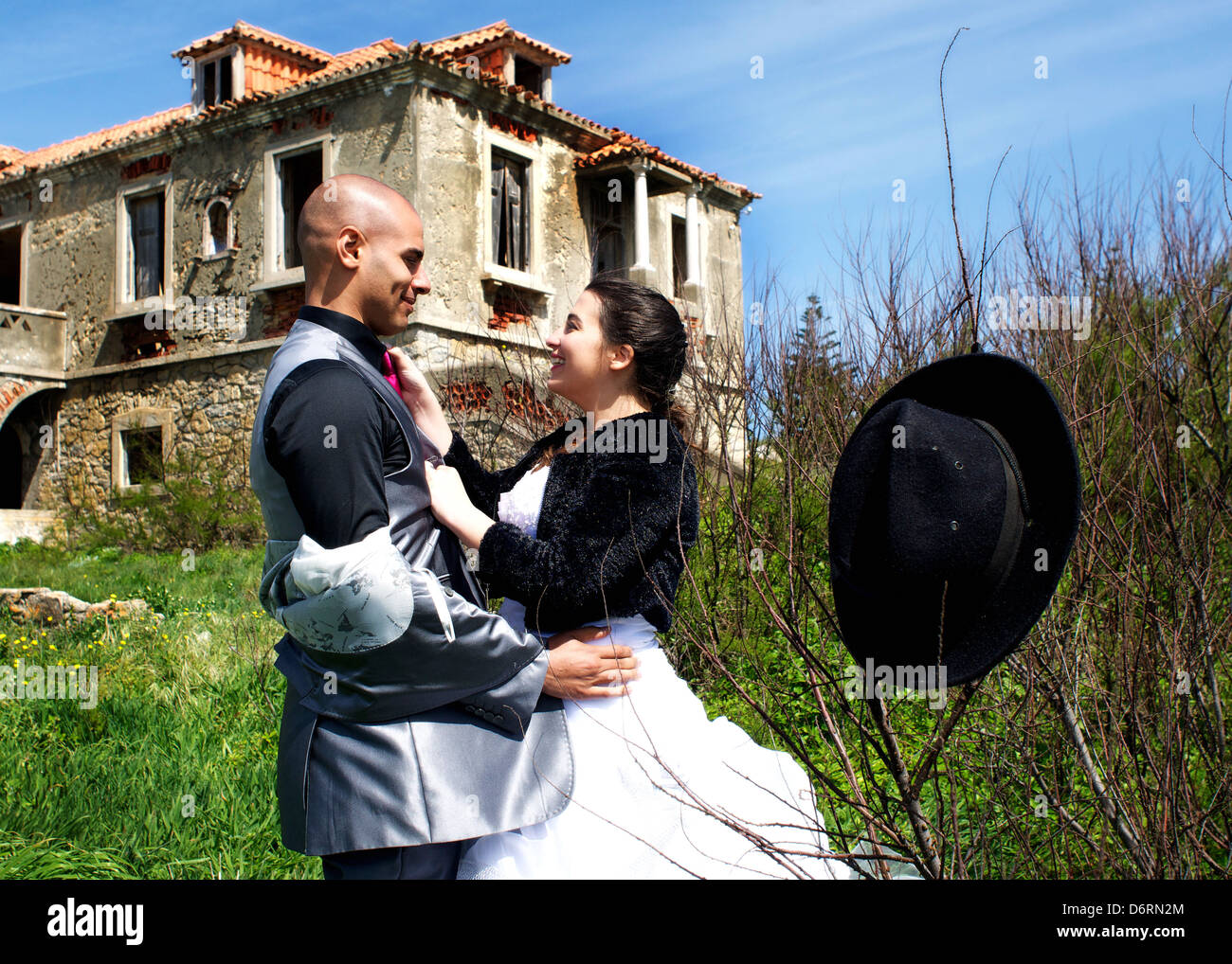 Bride and groom performing in a different wedding scene Stock Photo - Alamy