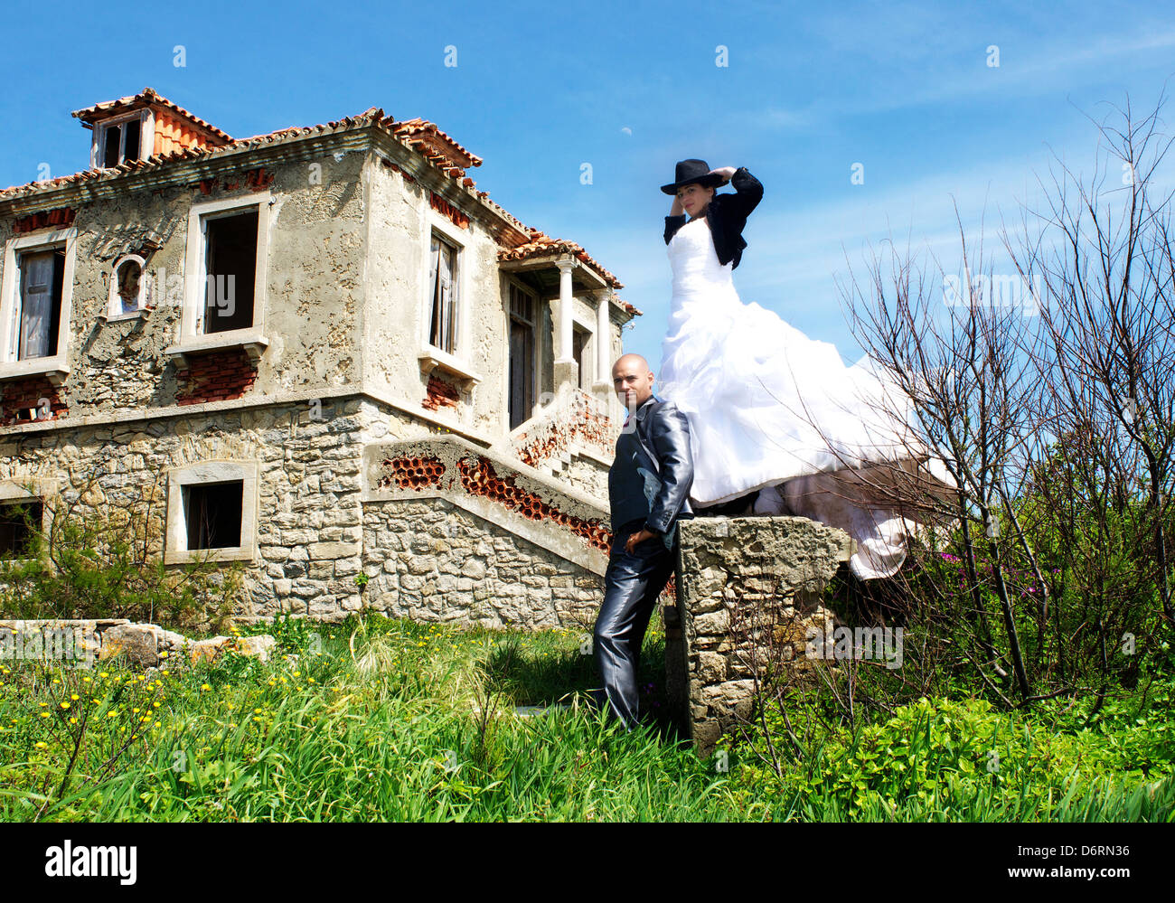 Bride and groom performing in a different wedding scene Stock Photo - Alamy
