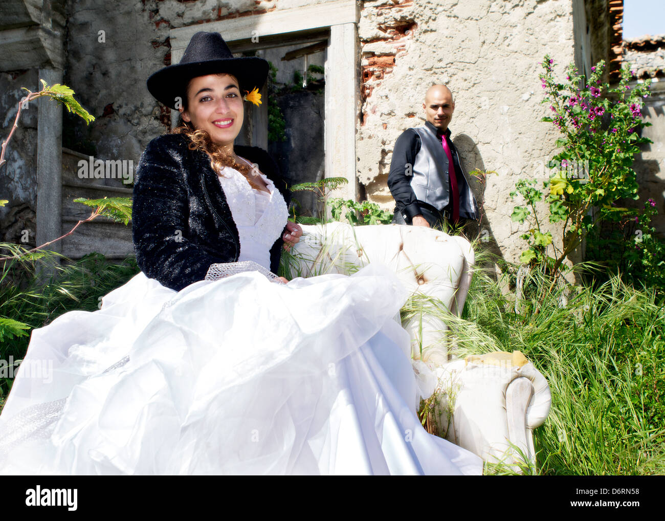 Bride and groom performing in a different wedding scene Stock Photo - Alamy