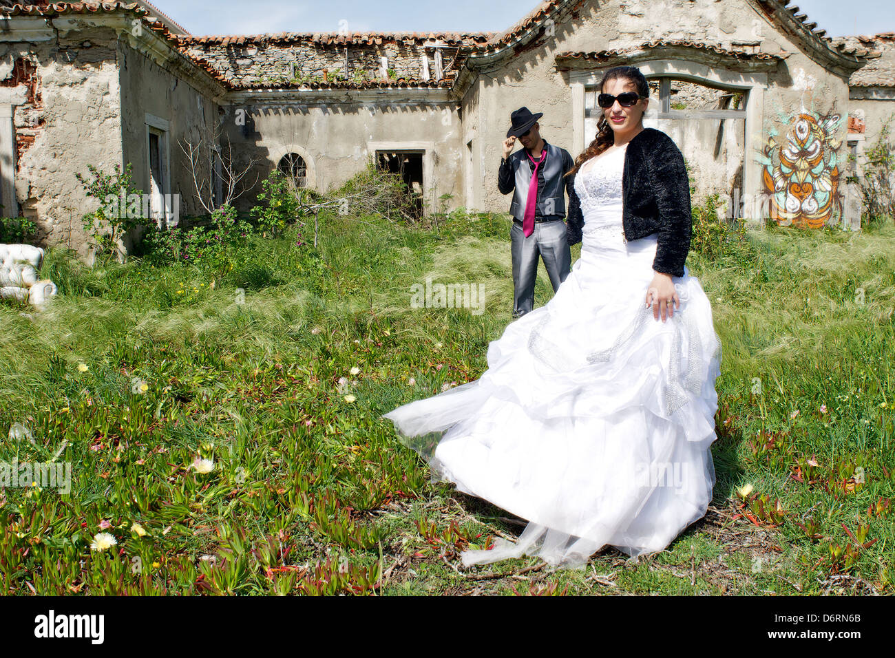 Bride and groom performing in a different wedding scene Stock Photo - Alamy
