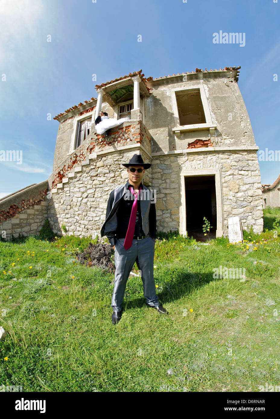 Bride and groom performing in a different wedding scene Stock Photo - Alamy