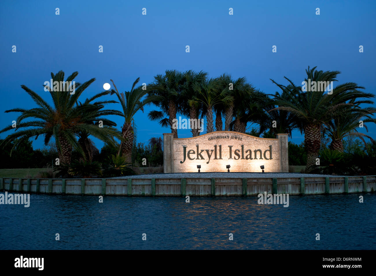 The entrance sign for Jekyll Island Georgia with full moon at twilight ...