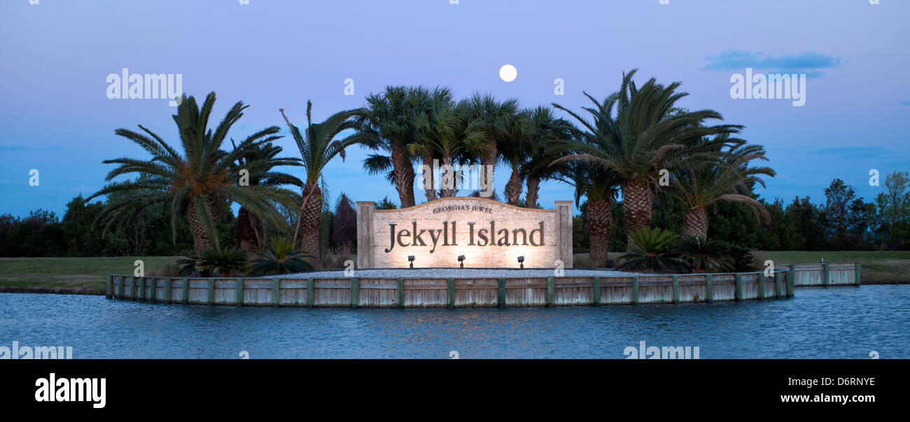 The entrance sign for Jekyll Island Georgia with full moon at twilight ...