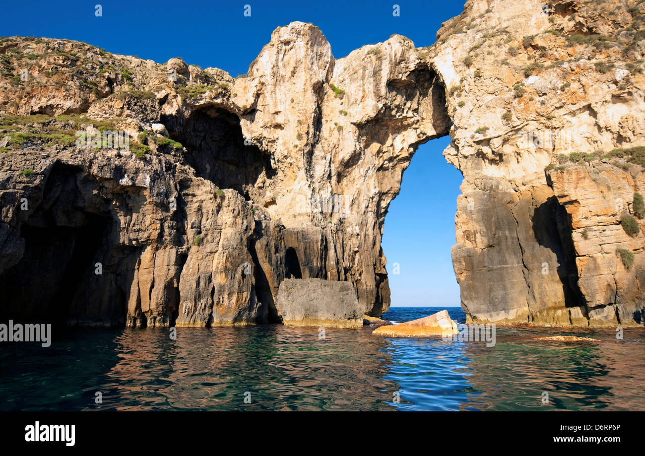 Greece, Peloponissos, Pylos, Sfaktiria Island, Sea cliff with natural ...