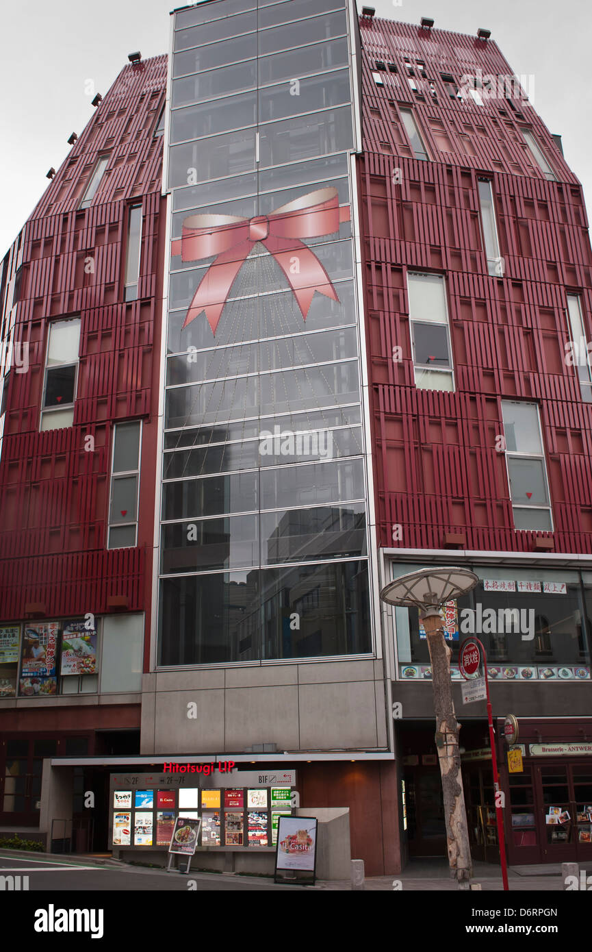 Red building with a bow tie, Tokyo, Japan Stock Photo - Alamy