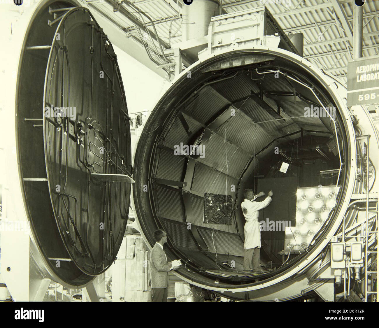 The photo shows Convair/General Dynamics engineers working in an ...