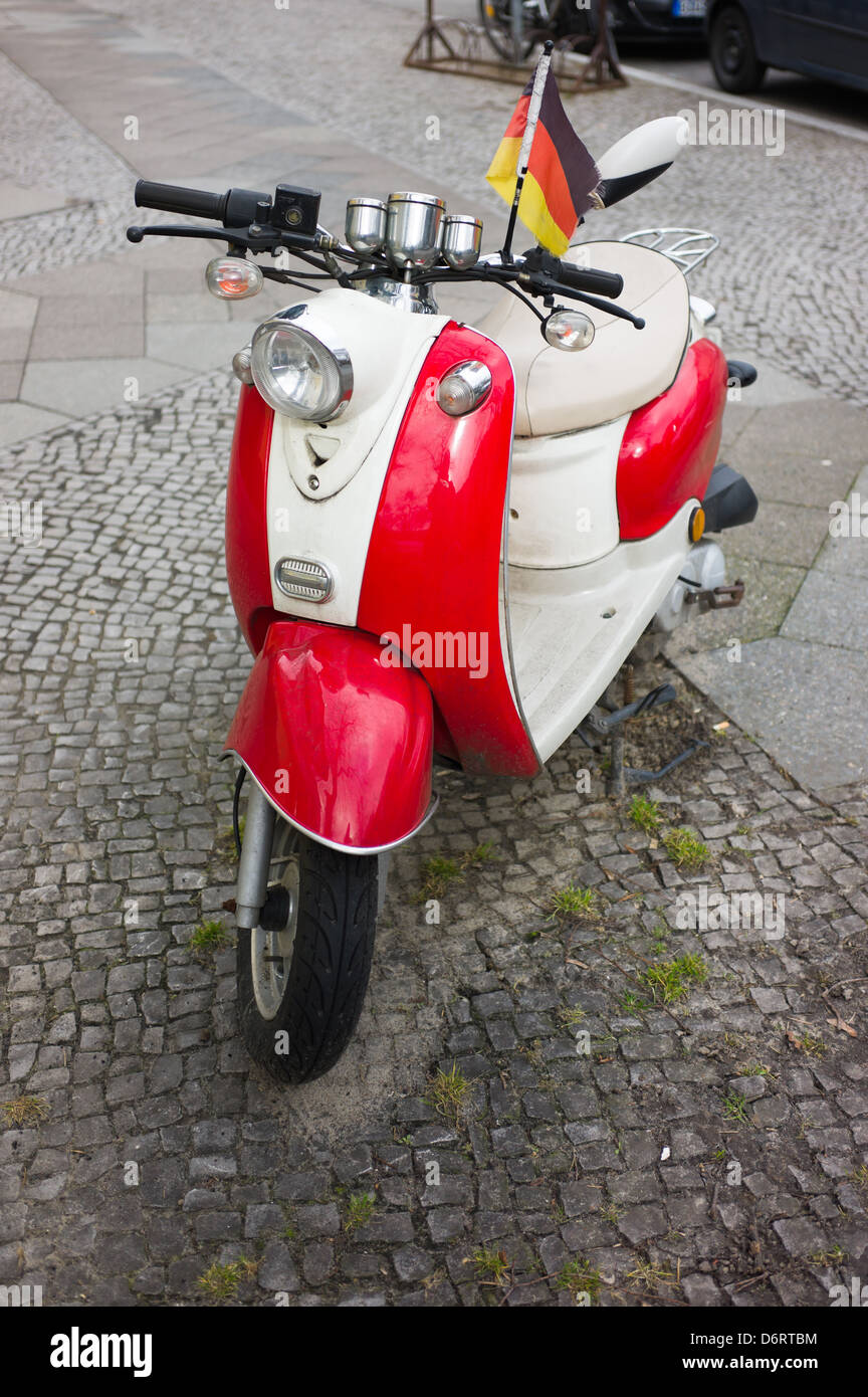 Berlin, Germany, a red and white scooter with Germany flag Stock Photo ...