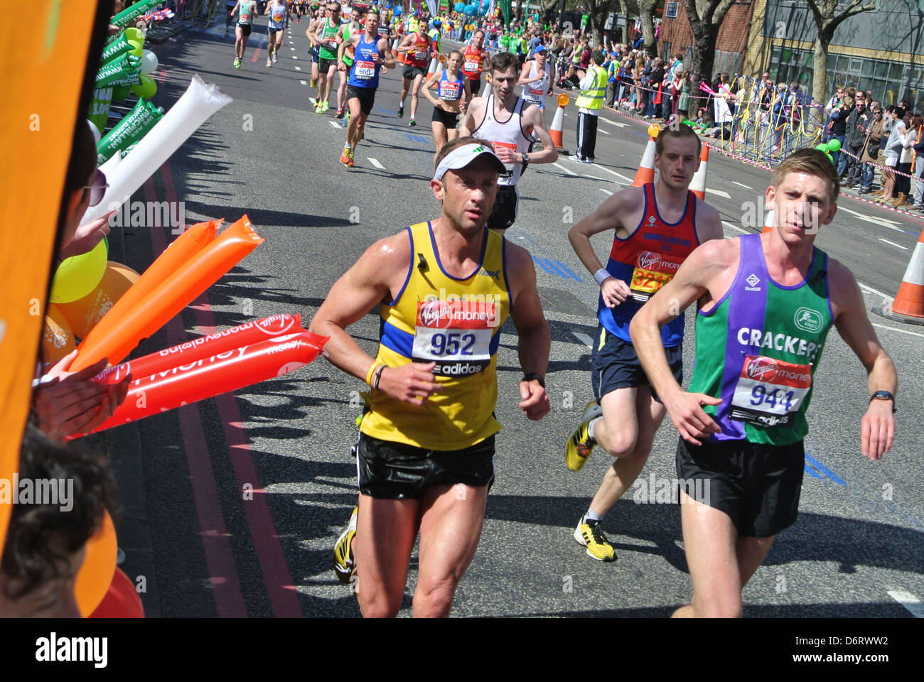London Marathon, Runners, blue road markings Stock Photo - Alamy
