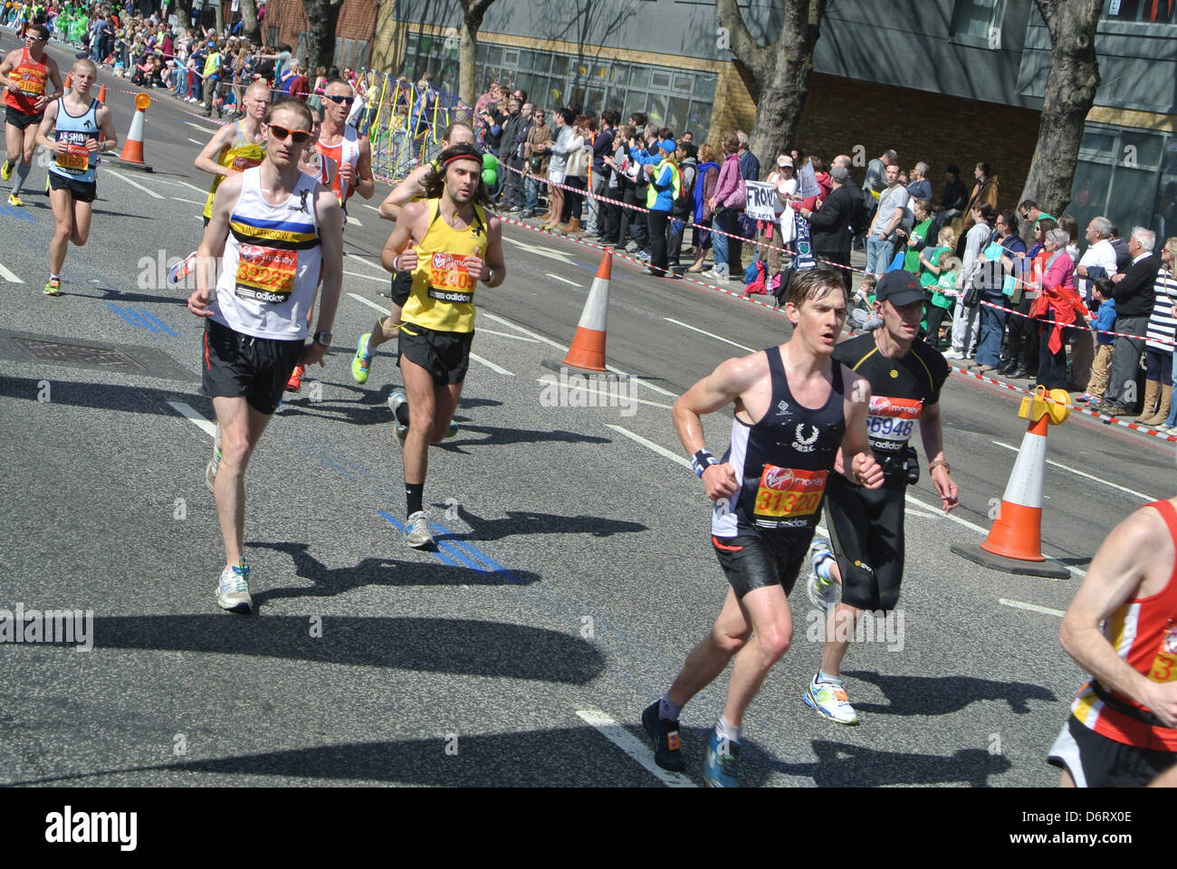 London Marathon, Runners, 13 miles, half way point, blue road markings ...