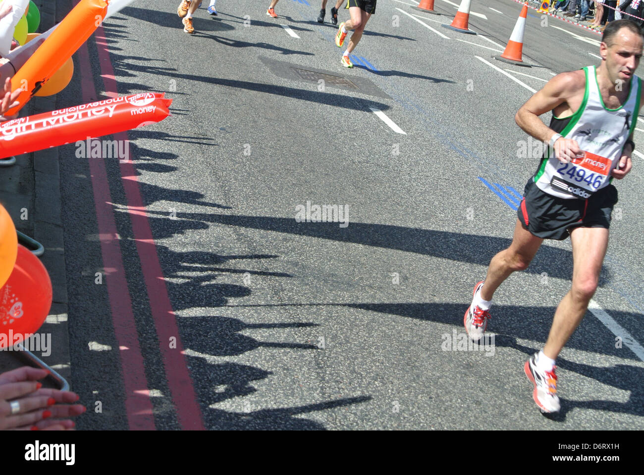 London Marathon runners, blue marks Stock Photo - Alamy