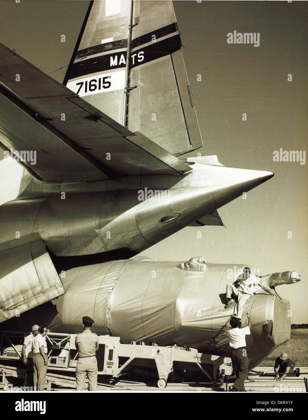 A photograph showing the unloading of an Atlas 3E missile at Patrick ...
