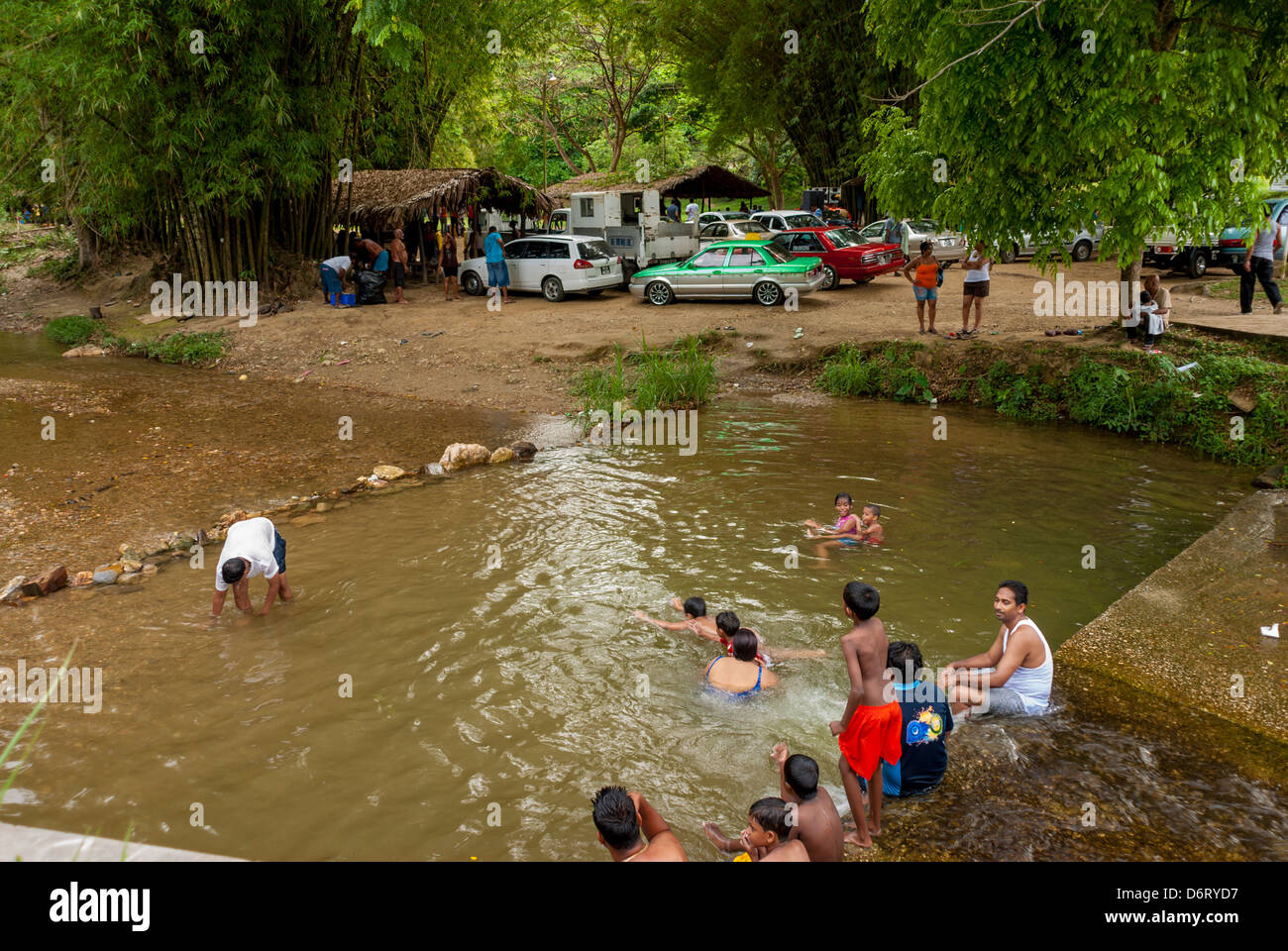 Children playing in the Lopinot River Stock Photo - Alamy
