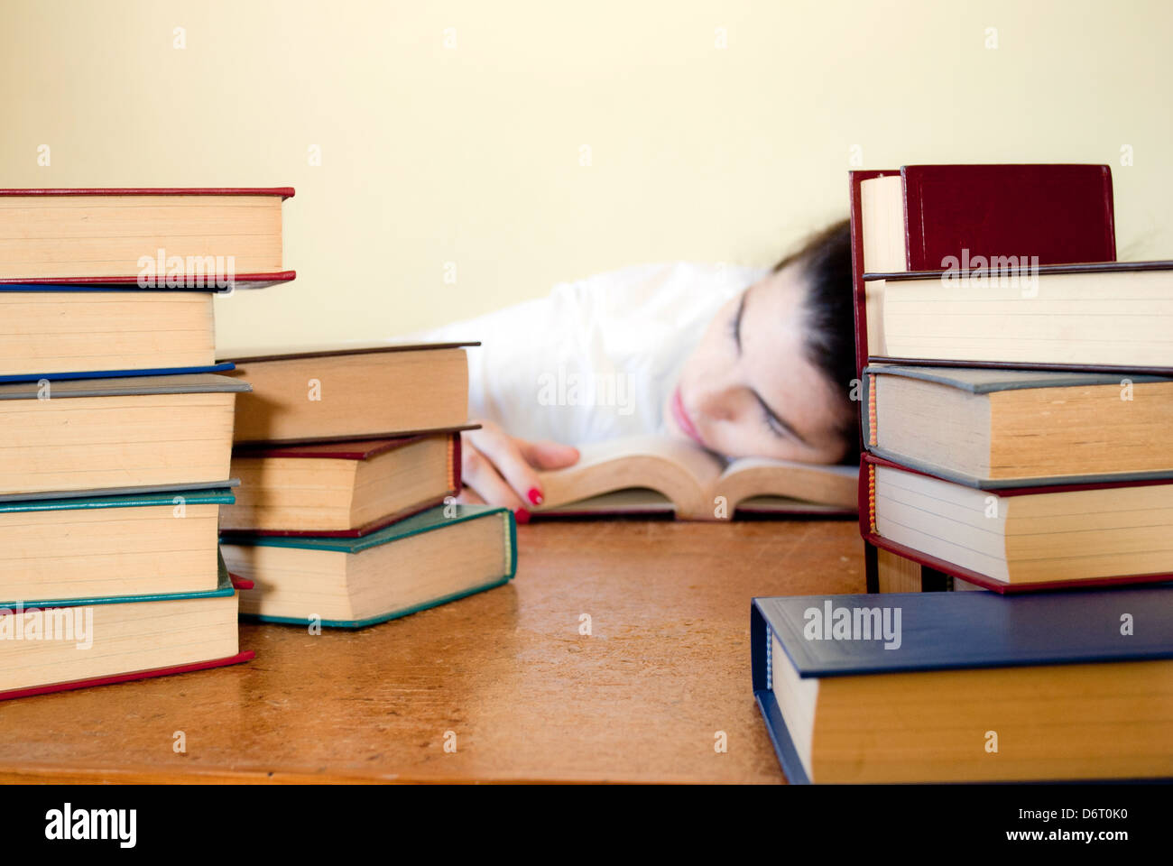 Young Woman sleeping after a hard study session Stock Photo - Alamy