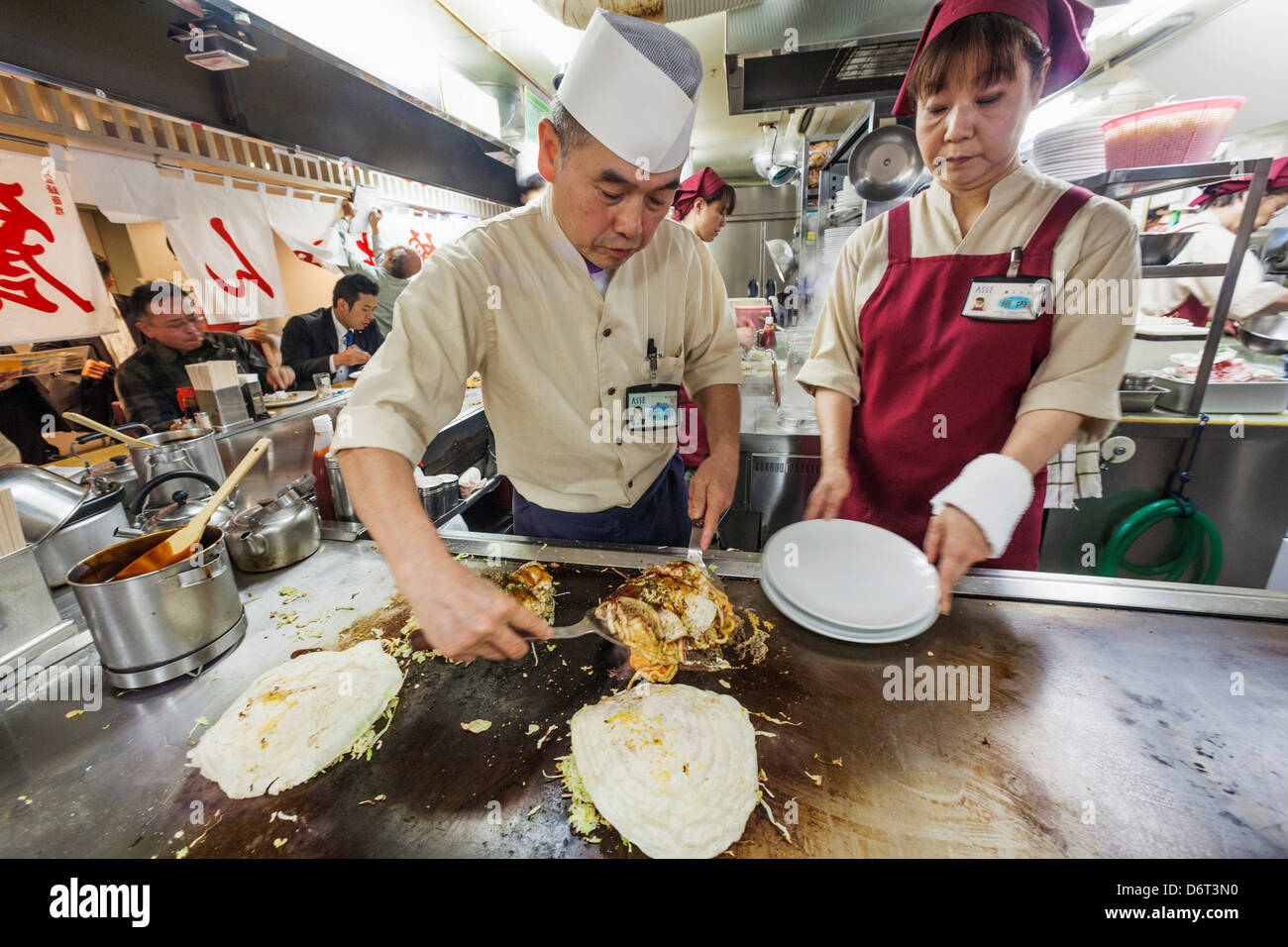 Japan, Kyushu, Hiroshima, Chef Cooking Okonomiyaki Stock Photo - Alamy