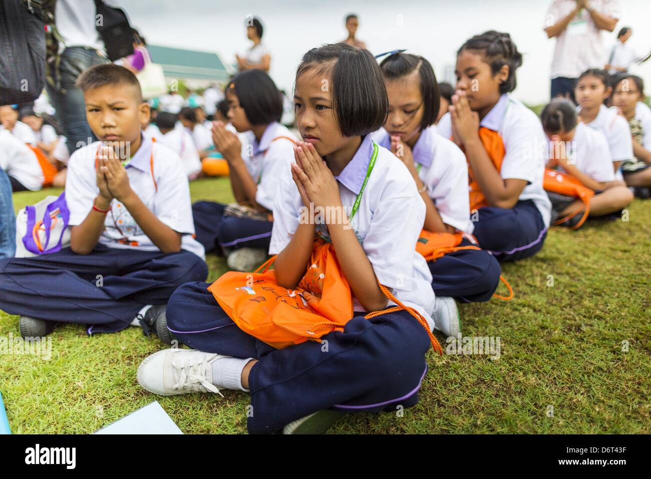 April 23, 2013 - Bangkok, Thailand - Thai students pray during the ...