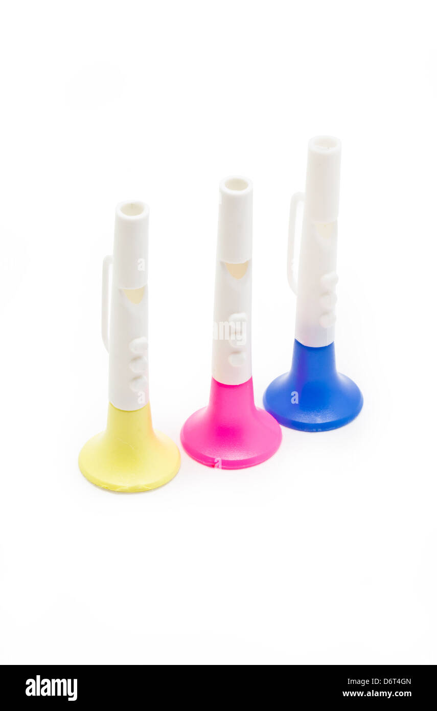 Children horn made of colored plastic isolated on white background ...