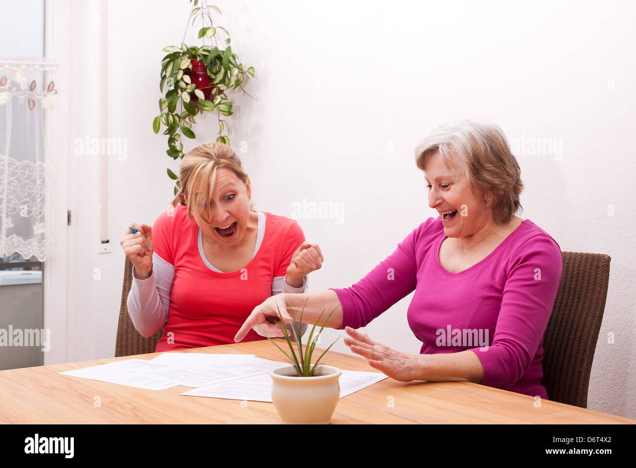 Two women are happy about positive message Stock Photo - Alamy