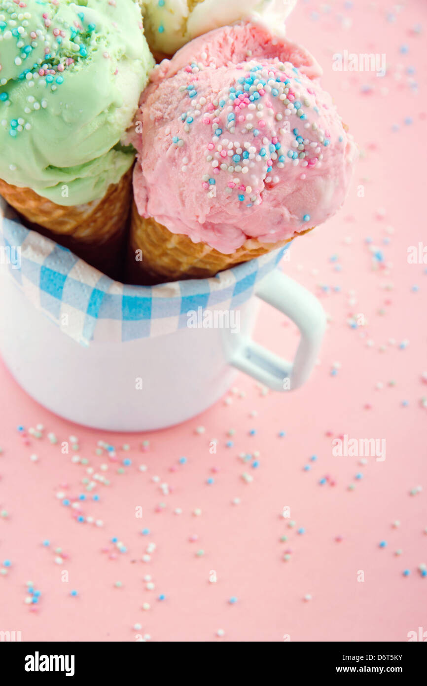 Ice cream cones in an old mug in pink shabby chic vintage background ...