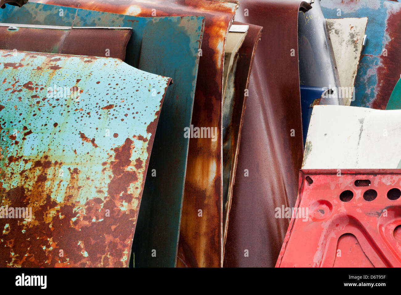 Stacked car hoods in wrecking yard Stock Photo - Alamy