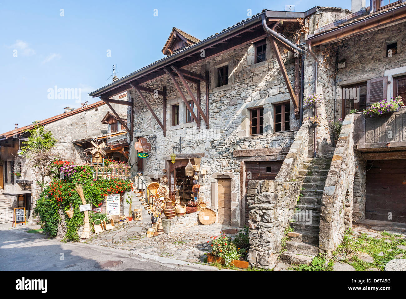 Yvoire, France - medieval fishing village - stone shops and houses ...