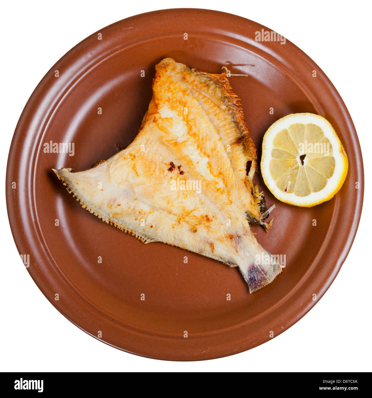 top view of fried sole fish on brown plate isolatd on white background ...
