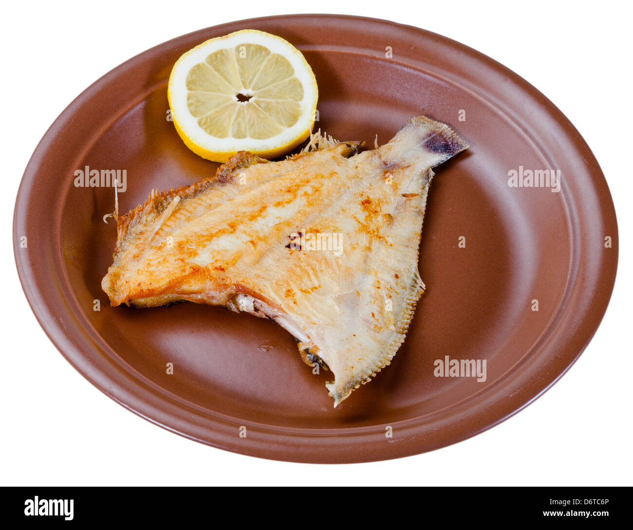fried sole fish on brown plate isolated on white background Stock Photo ...