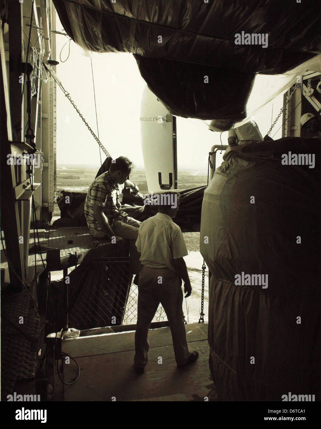 This image shows the installation of fairings on the payload for the ...