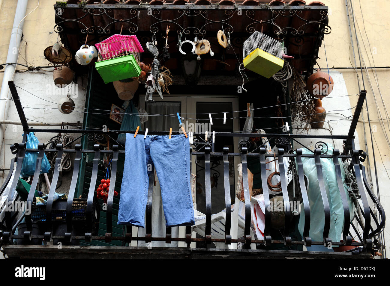 Clothes and other household goods hanging from balconies in Naples ...