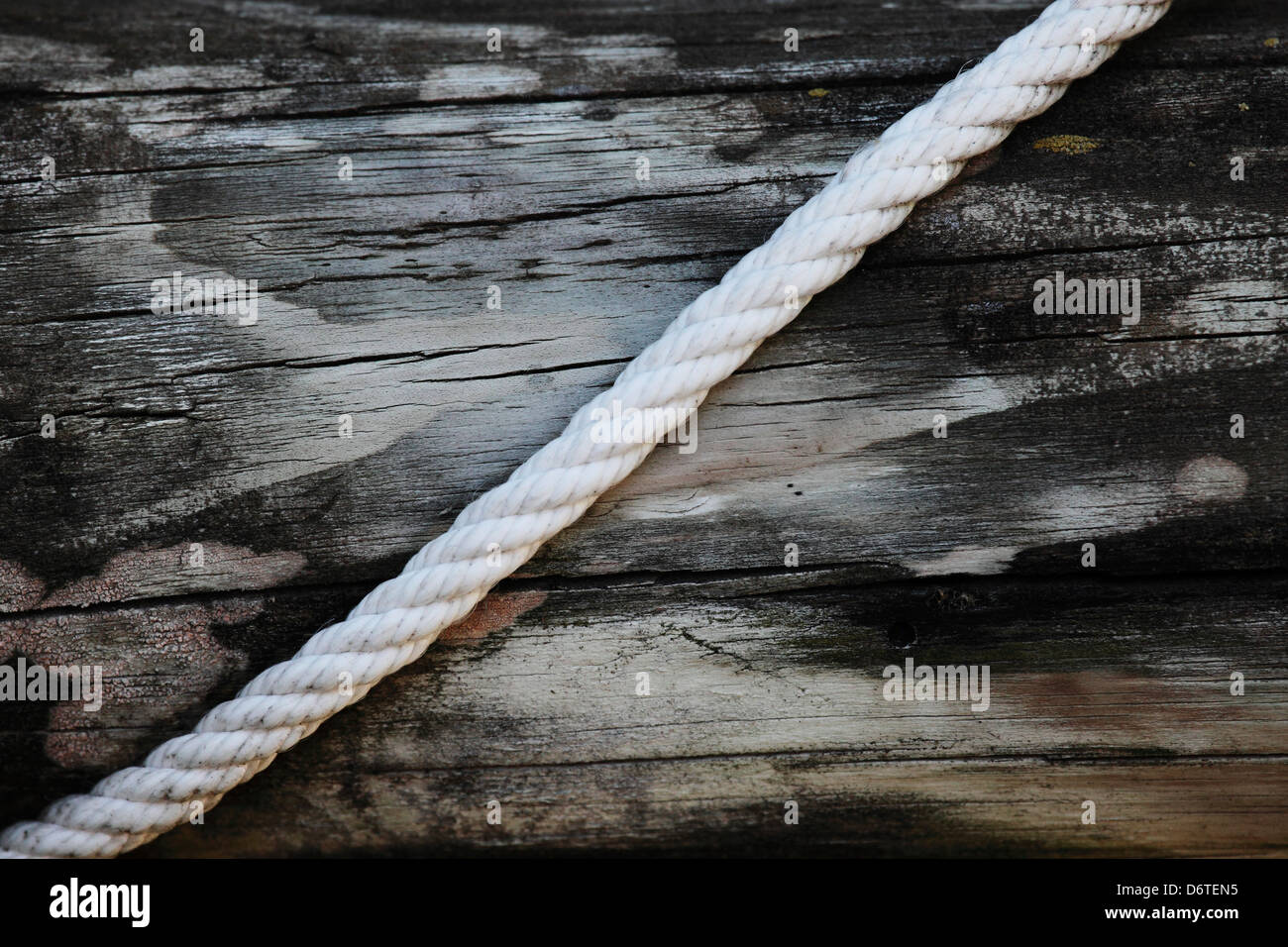 Picture of a rope over a wooden table Stock Photo - Alamy