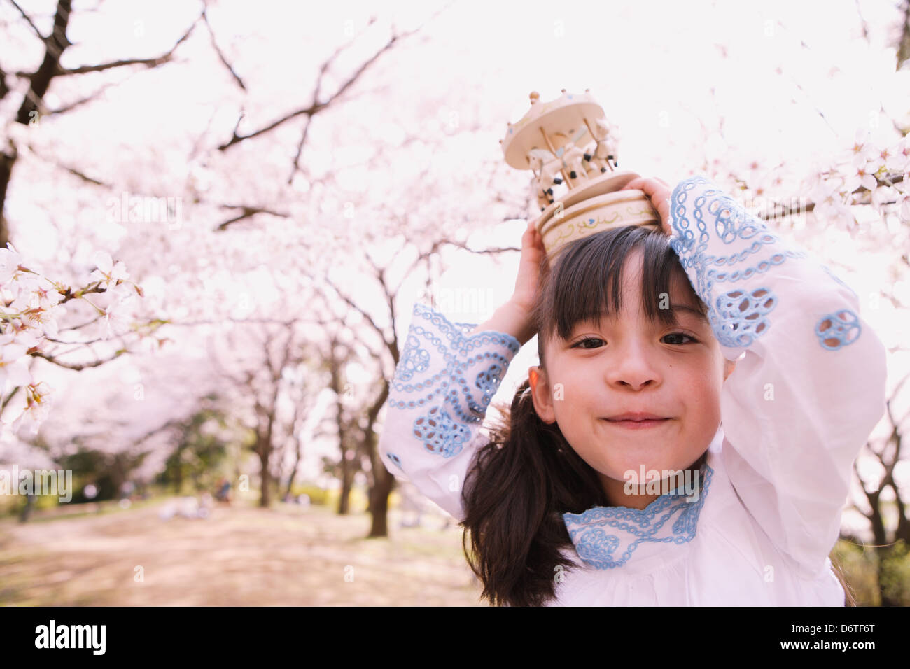 Young girl with merry-go-round smiling at camera Stock Photo - Alamy