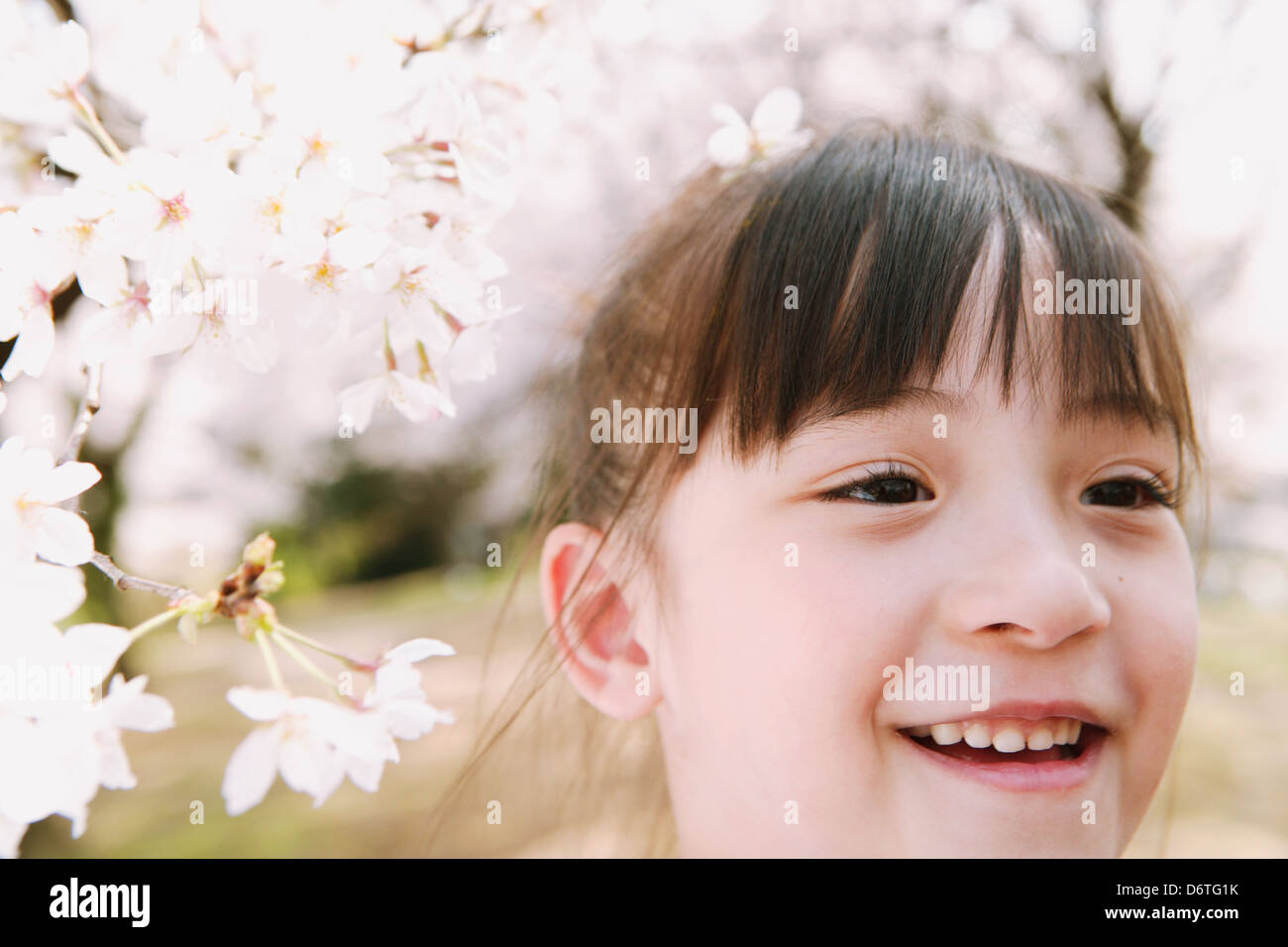 Young girl smiling away Stock Photo - Alamy