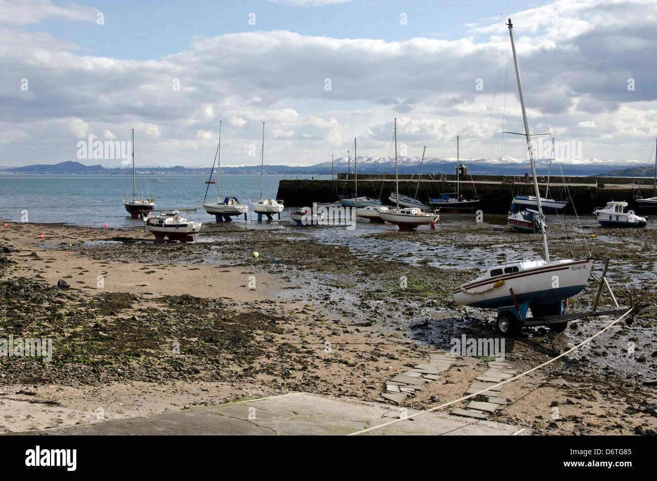 Aberdour Harbour in Fife, Scotland, with the extinct volcano "Arthur's ...
