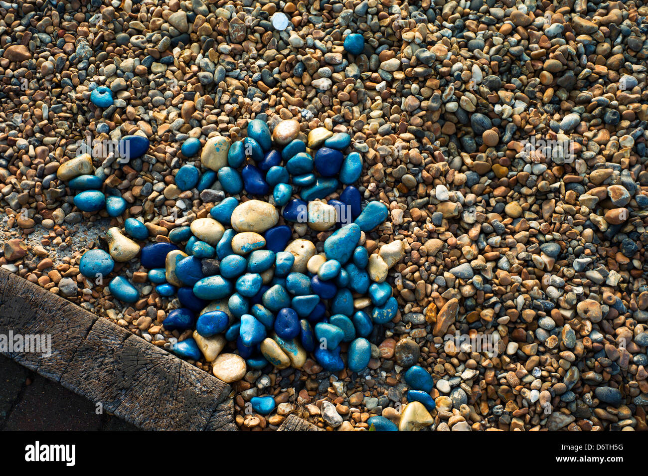 Painted blue pebbles scattered on beach, Brighton, UK Stock Photo - Alamy