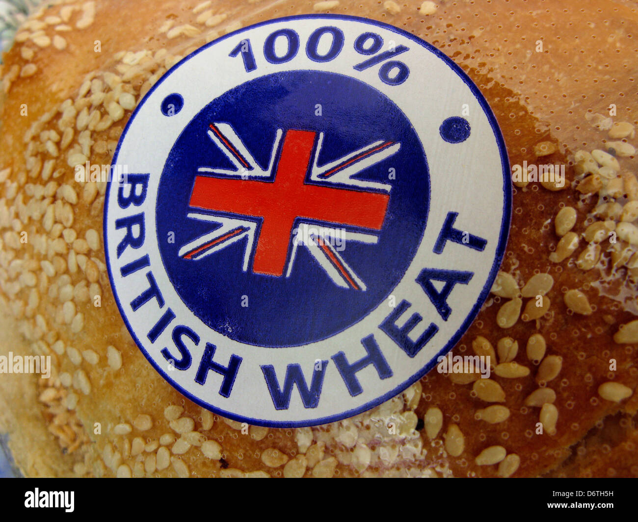 Freshly baked supermarket bread packaged with the sign made from 100% ...
