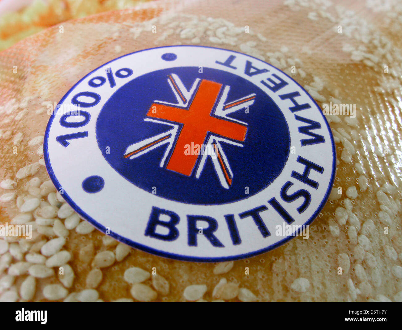 Freshly baked supermarket bread packaged with the sign made from 100% ...