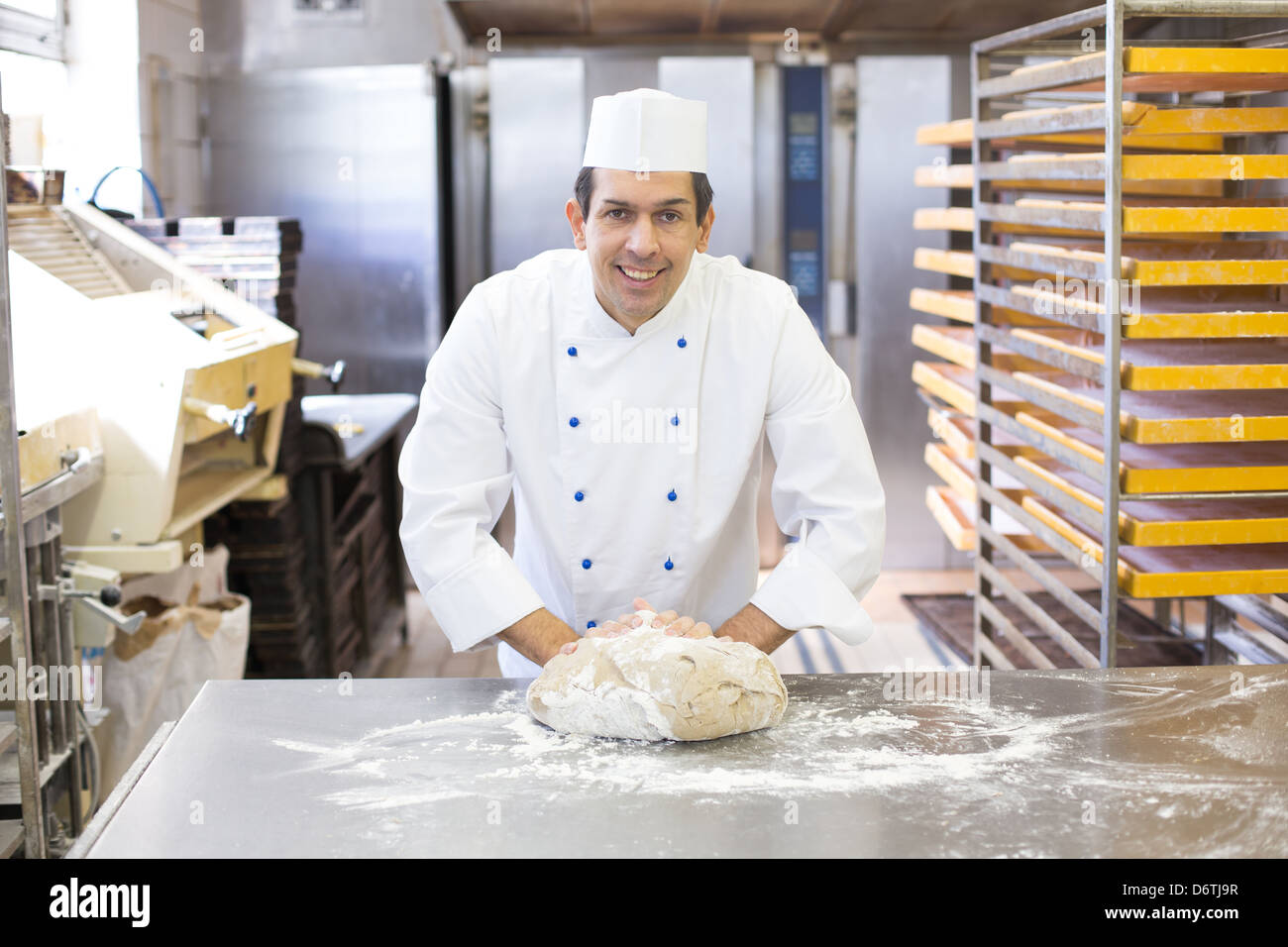 Baker kneading dough in hi-res stock photography and images - Alamy