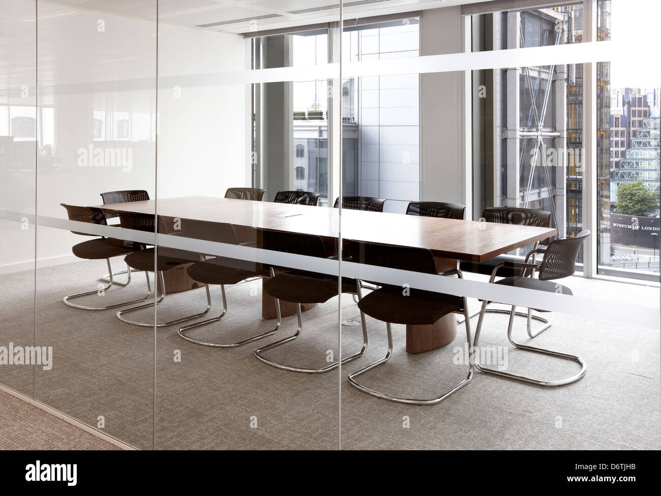 Glass walled meeting room plate glass city view Stock Photo - Alamy