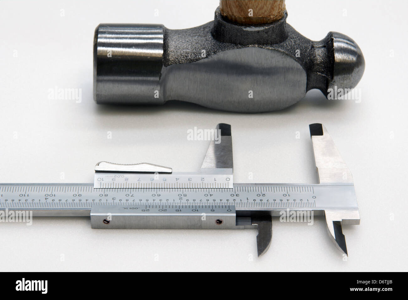 Engineers hammer and vernier caliper Stock Photo - Alamy