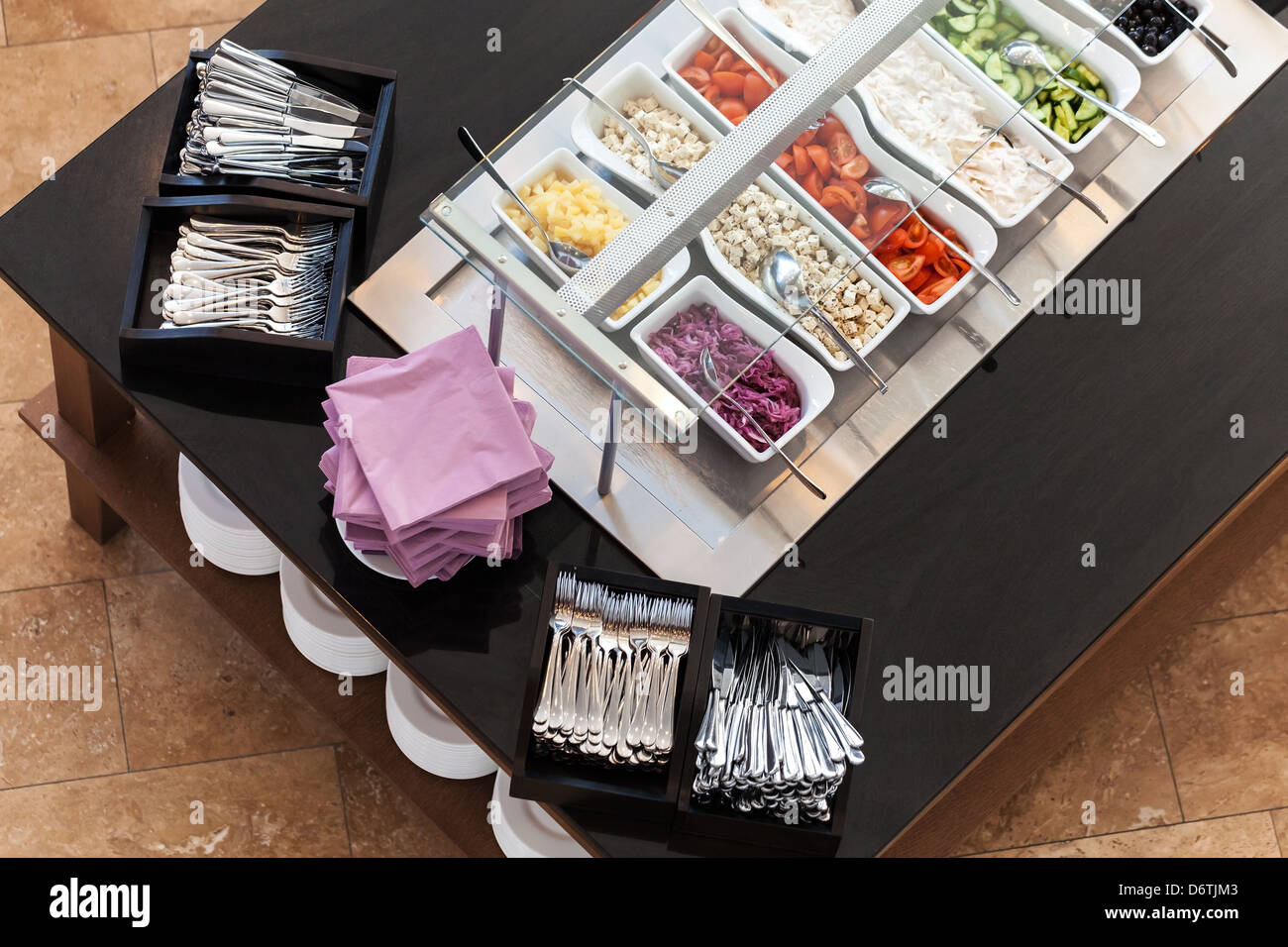 Buffet breakfast theme. Top view on black table with salads and ...