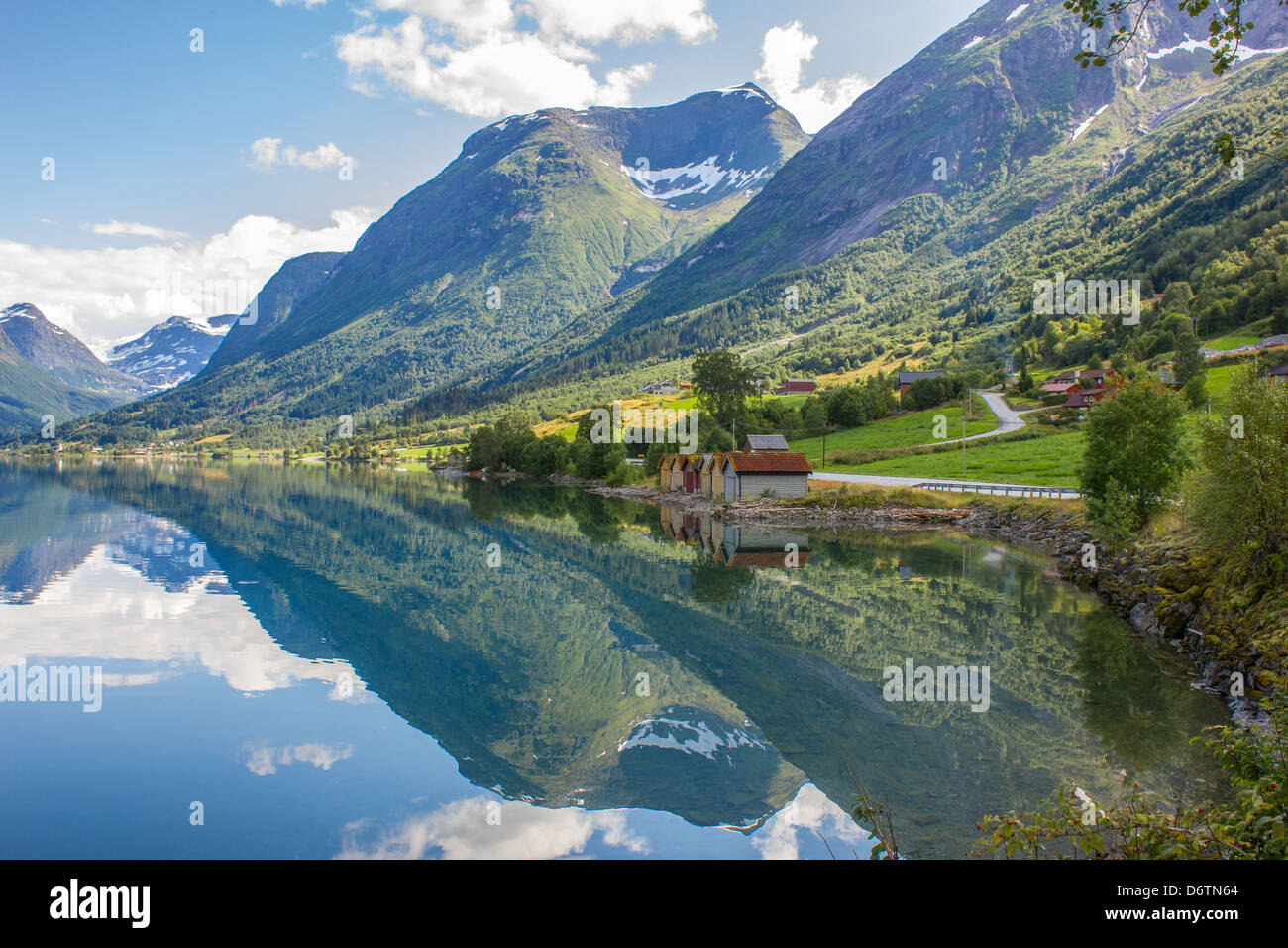 Scenic Norway with a mountain backdrop is reflecting in a mirror lake ...