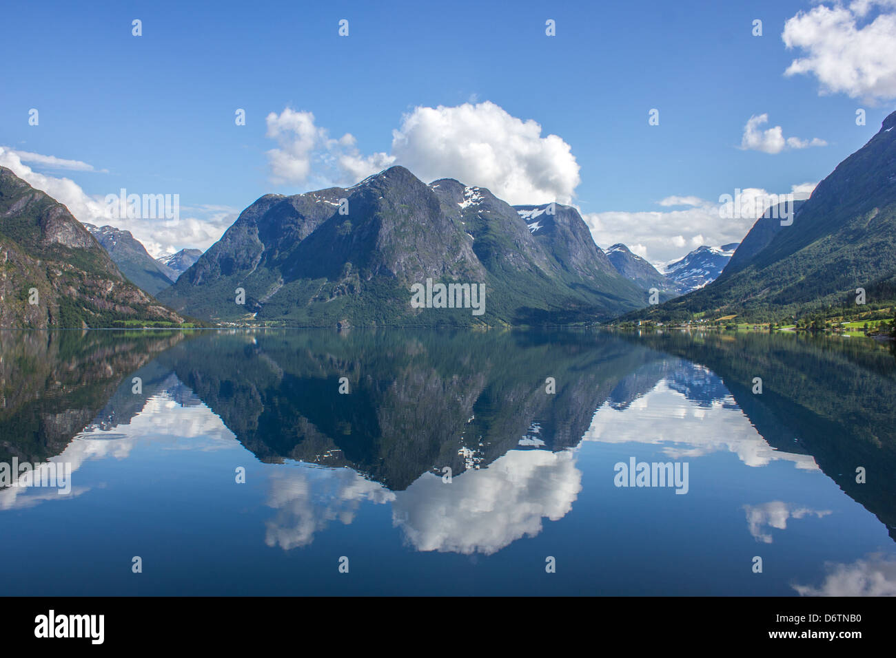 Scenic Norway with a mountain backdrop is reflecting in a mirror lake ...