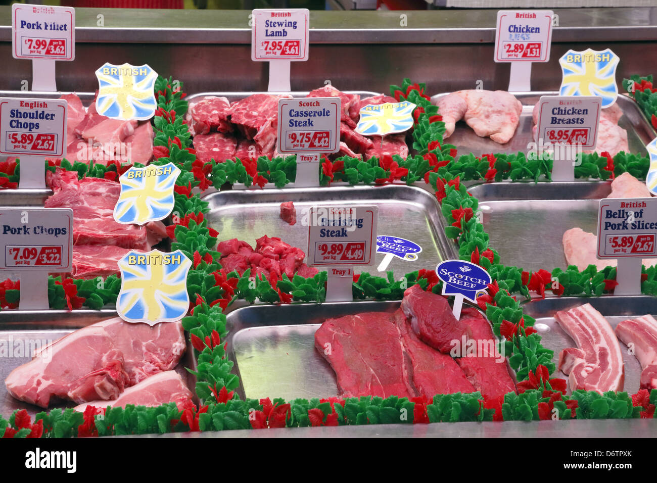 Meat displayed in a butchers shop Stock Photo - Alamy