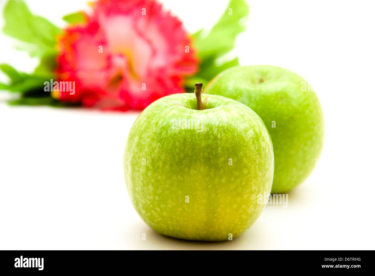 Green apple with flower Stock Photo - Alamy